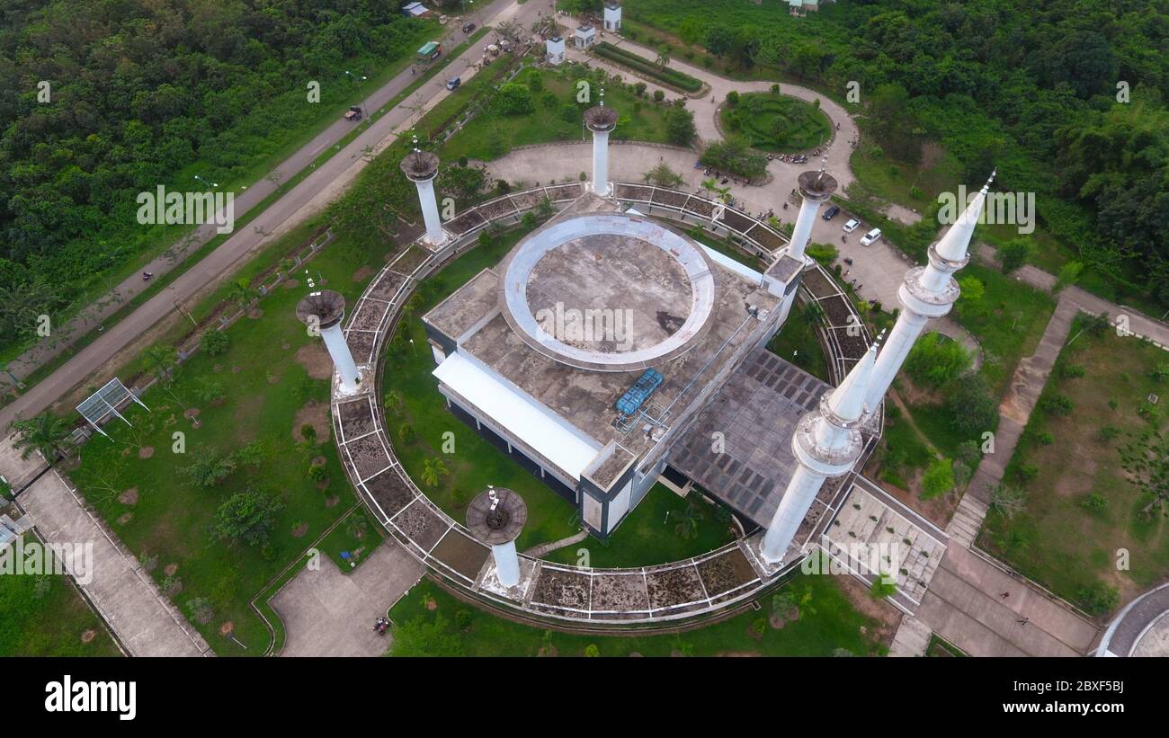 Aerial view of Al Abrar Mosque with forest background in the month of ...