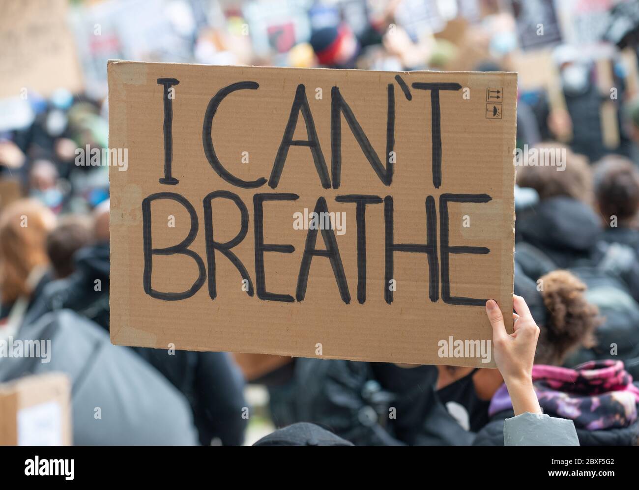 Protester holding up campaign / supportive poster/ sign, at the London ...