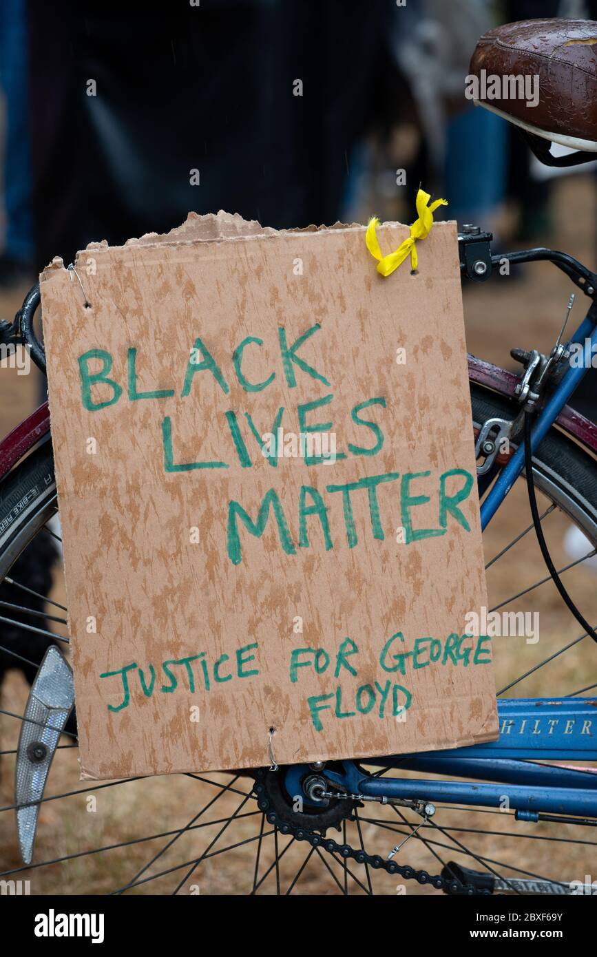 Protest campaign / supportive poster/ sign attached to bicycle, at the ...