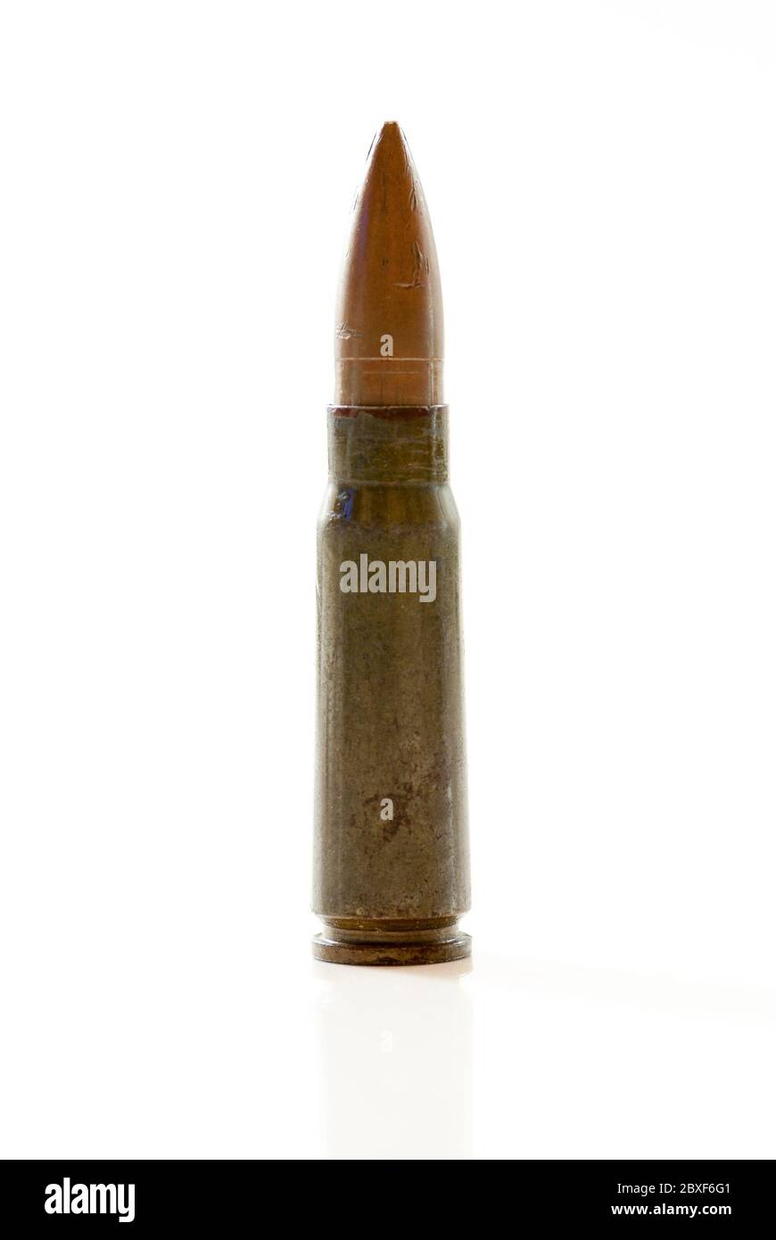 gun cartridge with bullet and case on white background with reflexion ...