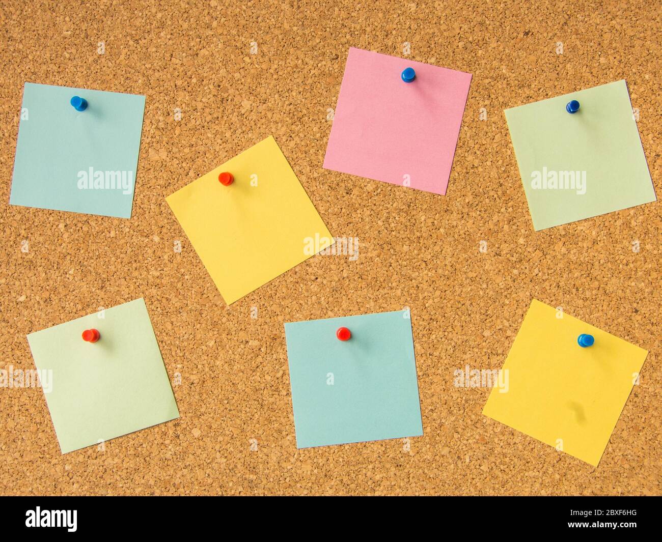 cork board seven pinned post it files Stock Photo - Alamy