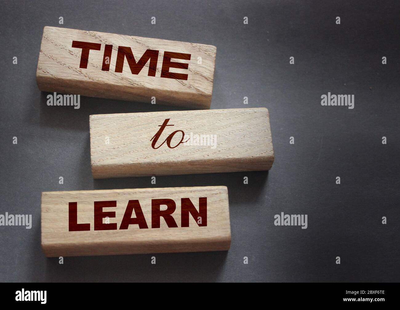 Time to Learn on wooden blocks put black. Education concept. Life-time ...