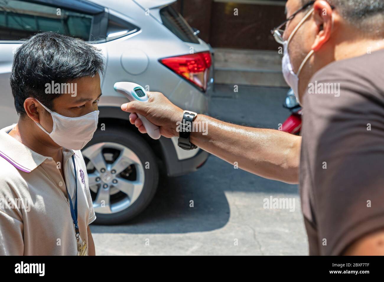 Temperature check at free food distribution during Covid pandemic ...