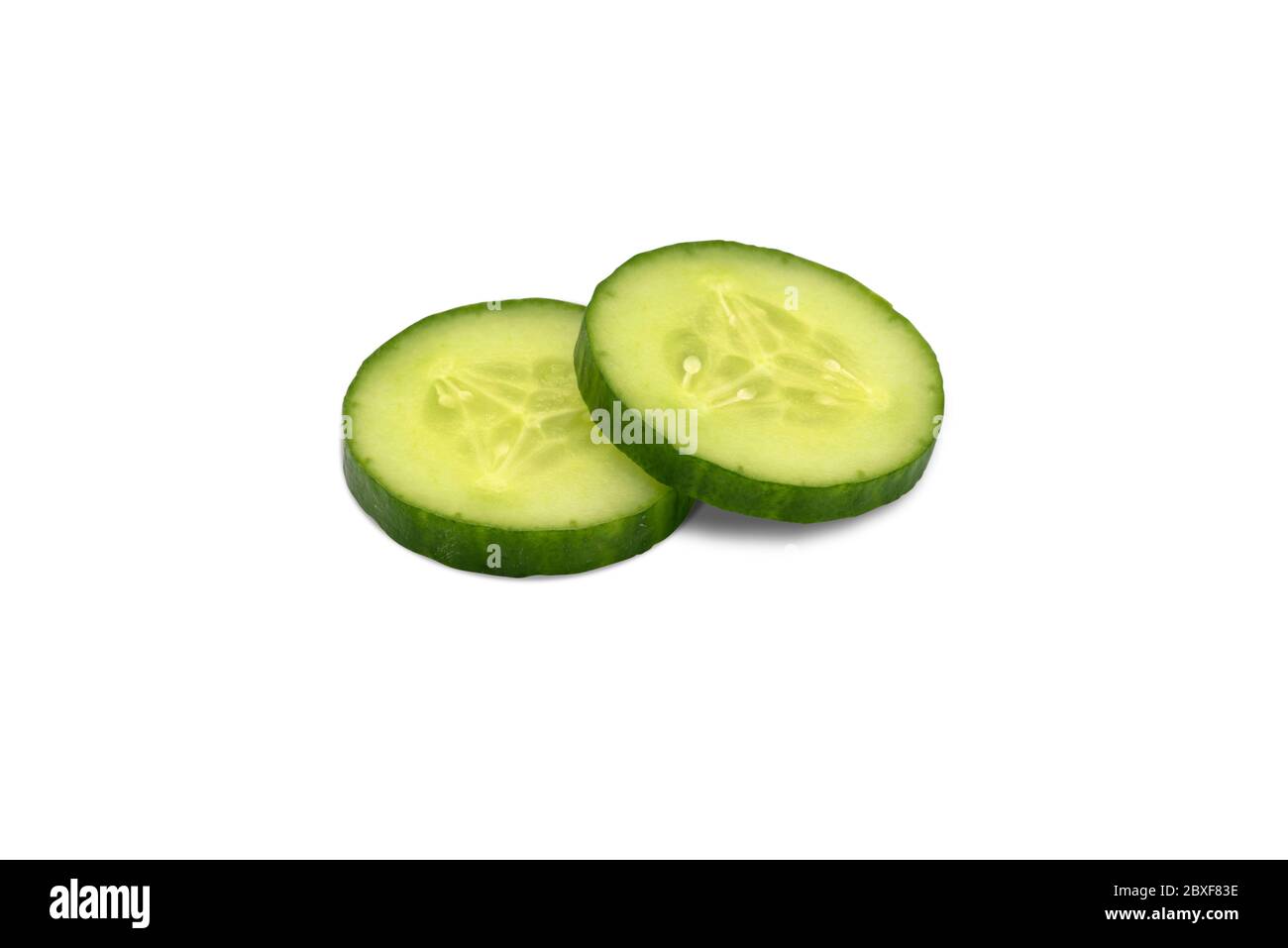 Fresh slice cucumber close-up on a white background Stock Photo - Alamy