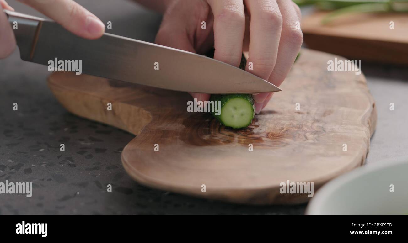 Hands cutting cucumber fresh green hi-res stock photography and images ...