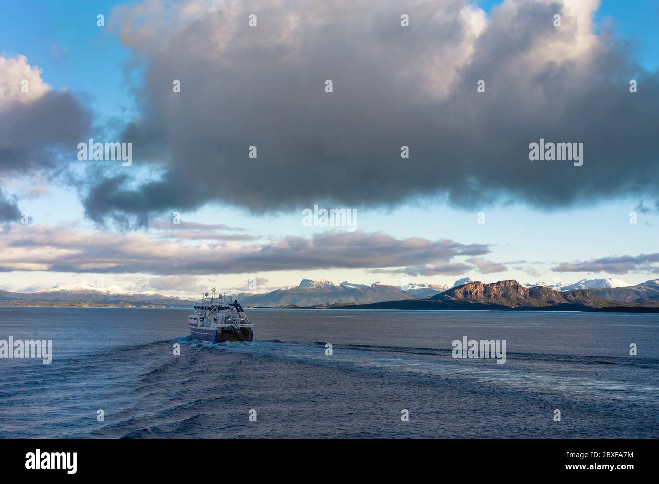 The fishing trawler "Langøy" making passage up the Edøyfjorden, Møre og ...