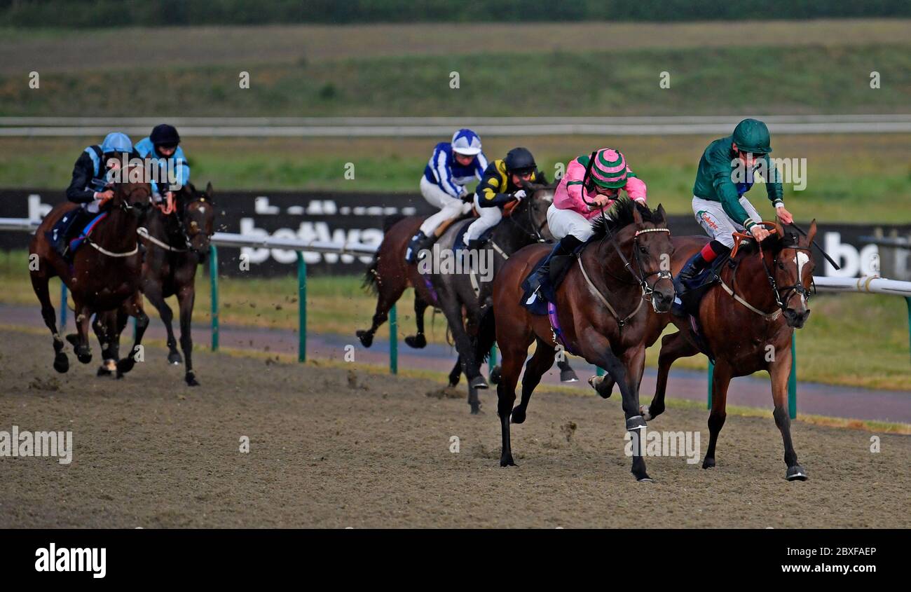 Billhilly ridden by Charlie Bishop (pink) wins the Betyourway at Betway ...