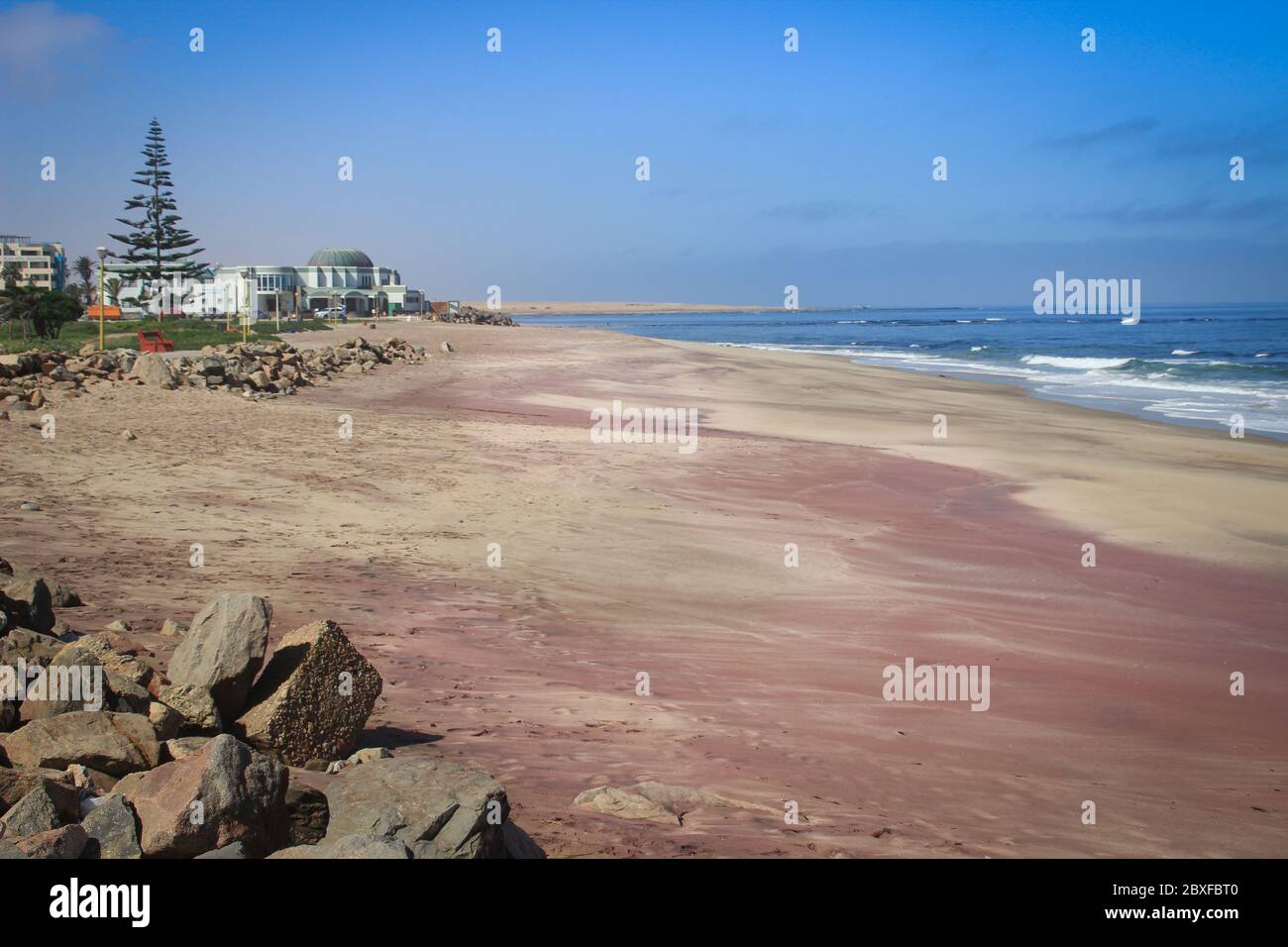 Beautiful pink sand on the shores of the Atlantic Ocean, waves and ...