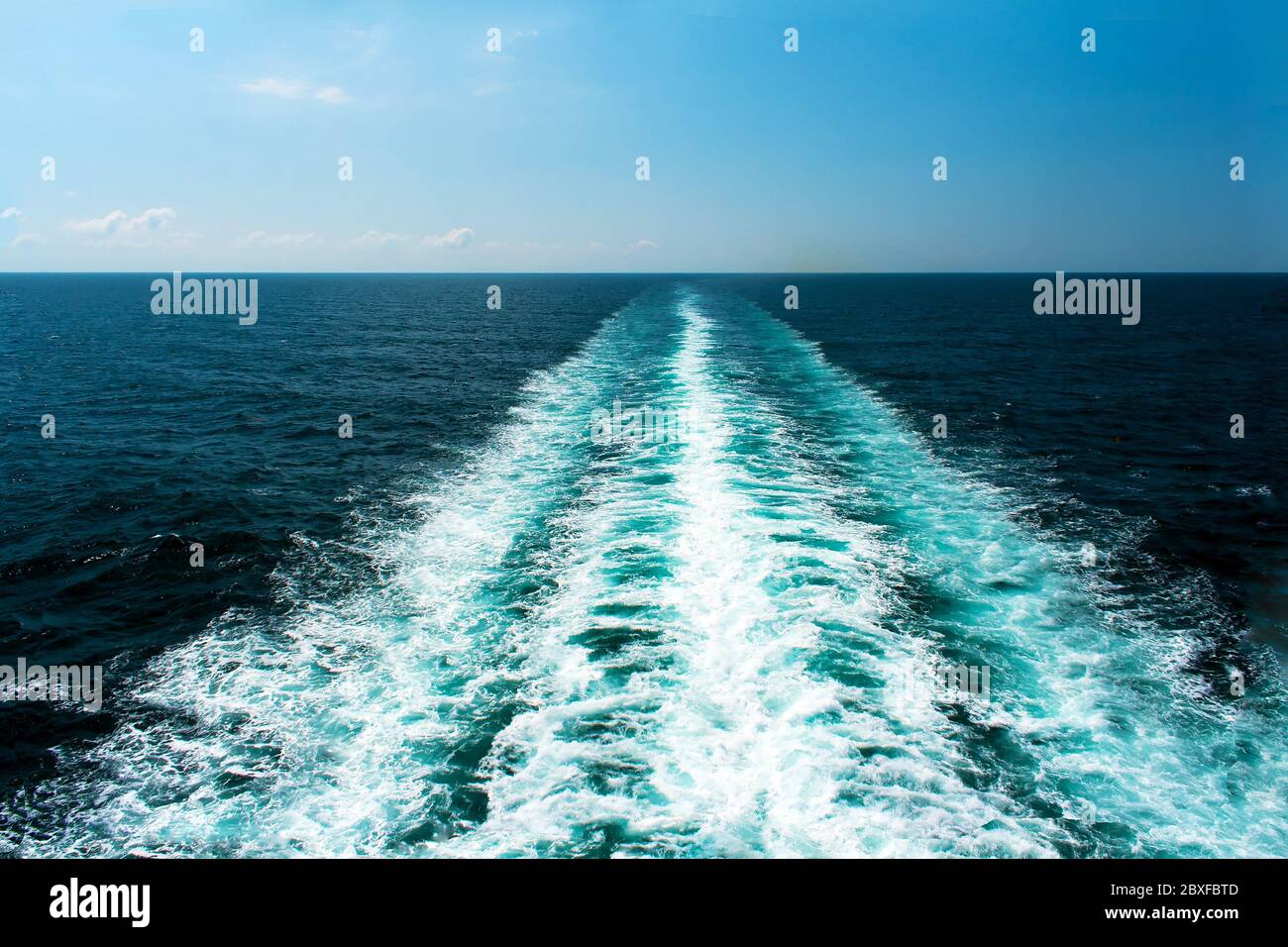 Wake from a cruise ship with blue sky and ocean Stock Photo - Alamy