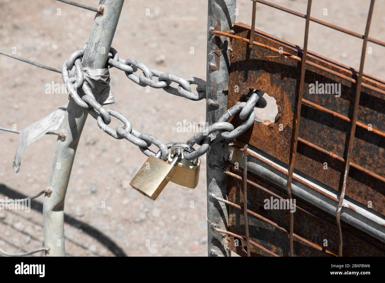 Two padlocks locked together hi-res stock photography and images - Alamy