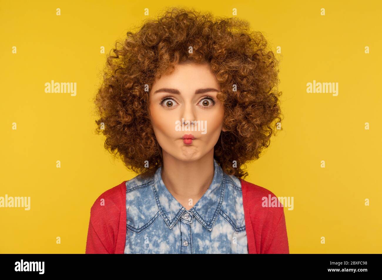 Closeup portrait of cute funny woman with fluffy curly hair expressing ...