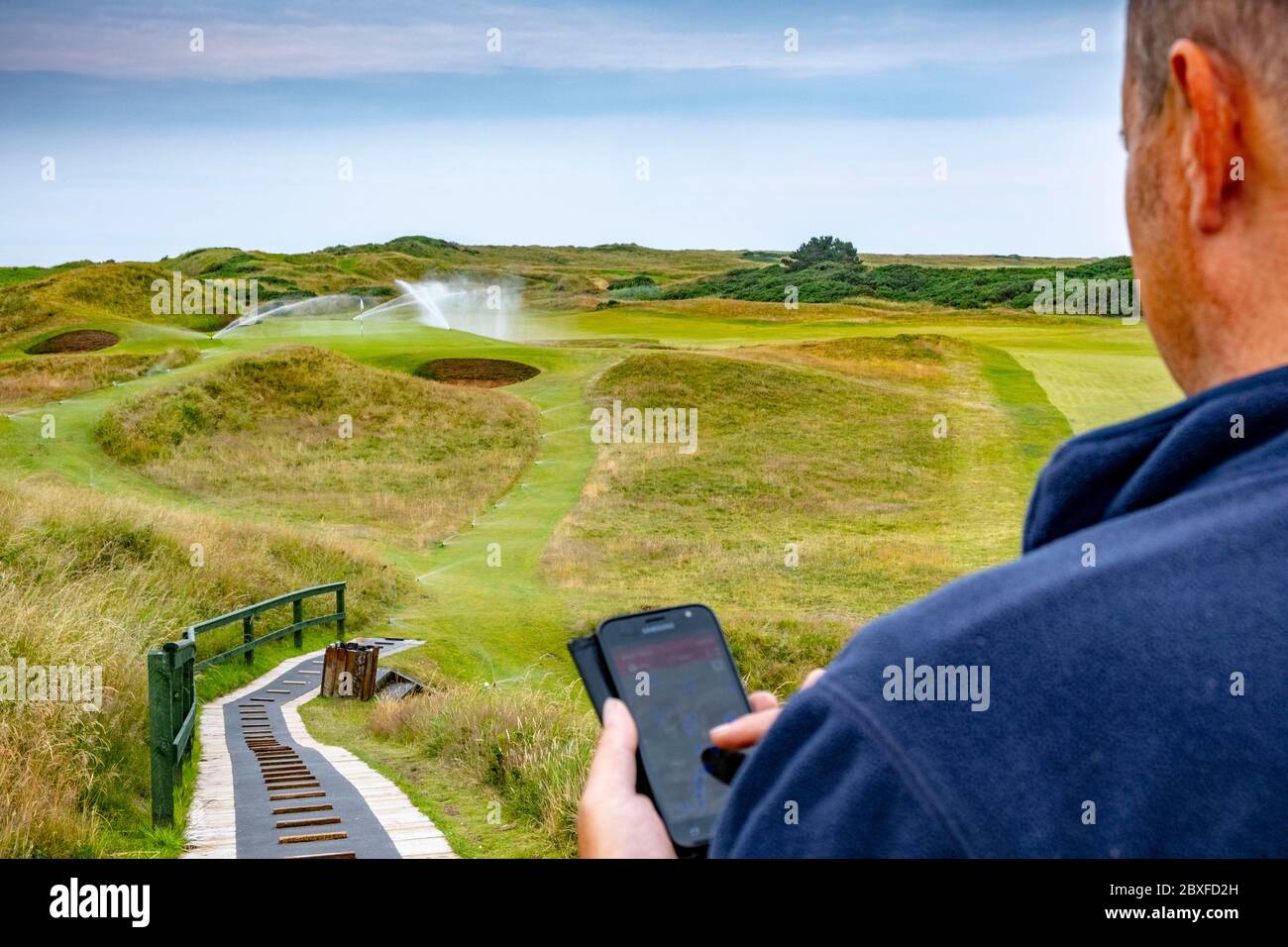 Irrigation system on golf course Stock Photo - Alamy