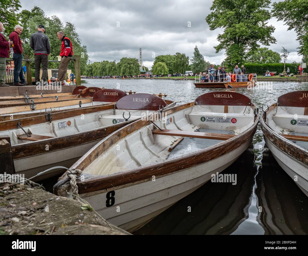 Rowing boats moored on the River Avon at Stratford upon Avon with the ...
