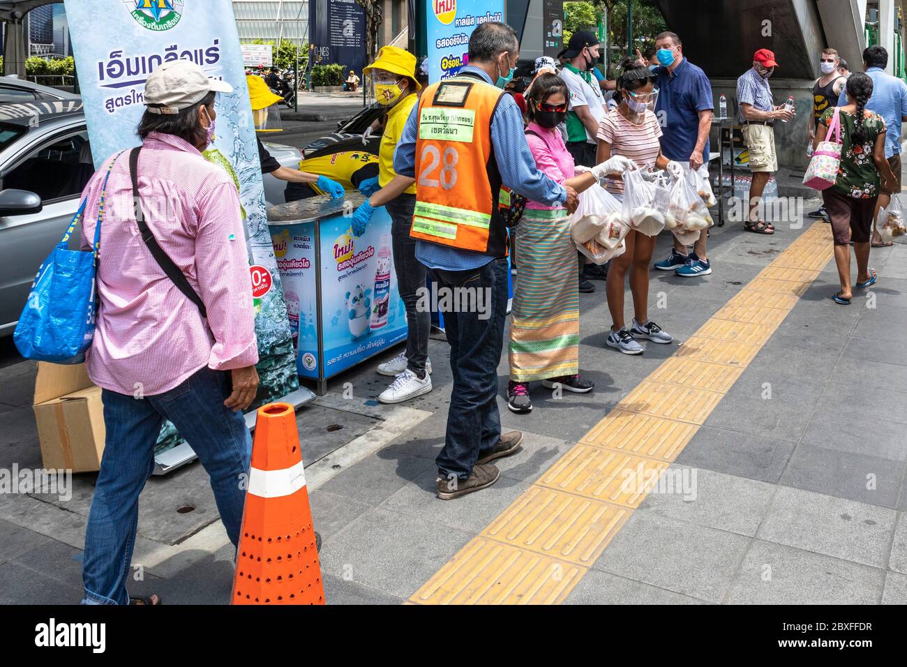 Queue for free food at food bank kitchen during Covid pandemic, Bangkok ...