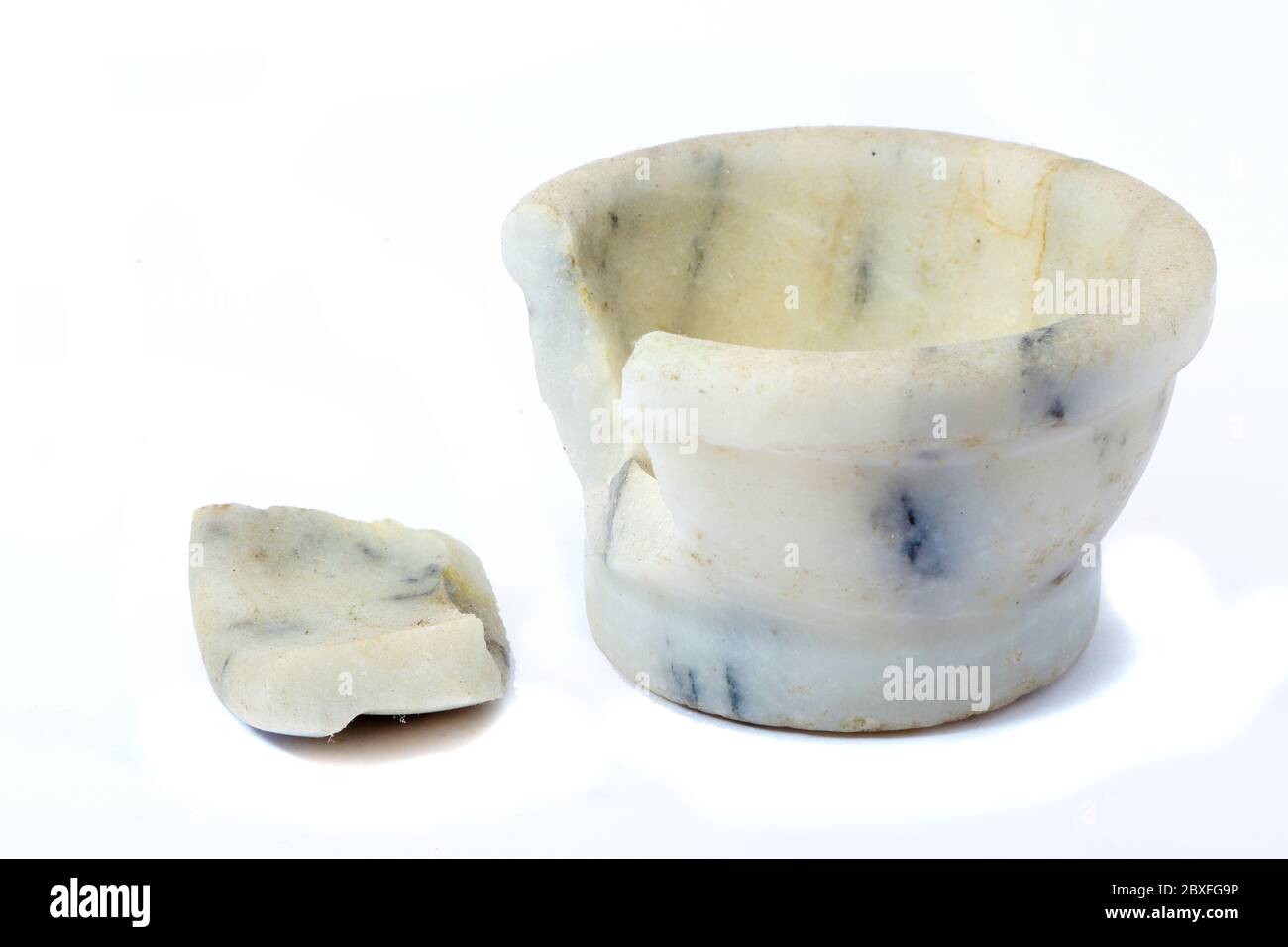 Broken Marble mortar and pestle Stock Photo - Alamy