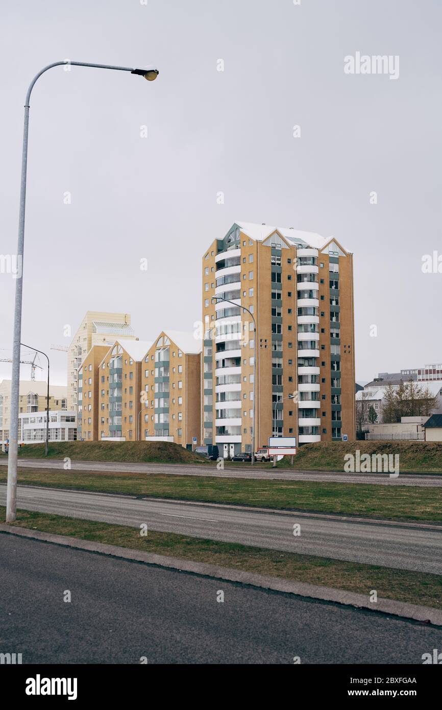 Yellow high-rise buildings on the waterfront in Reykjavik, the capital ...