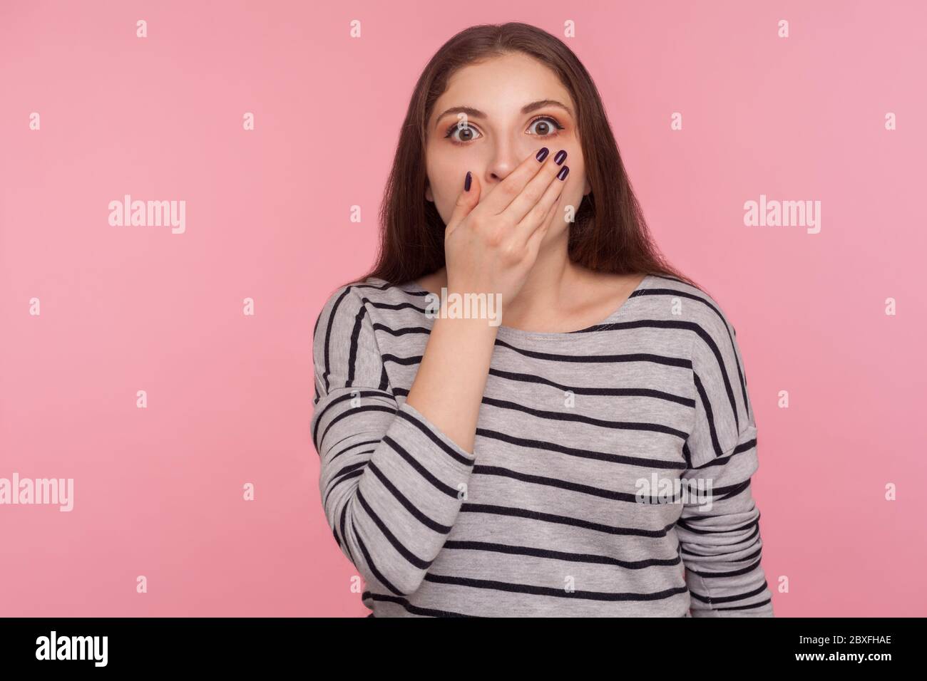 I won't say anyone. Portrait of scared intimidated woman in striped ...