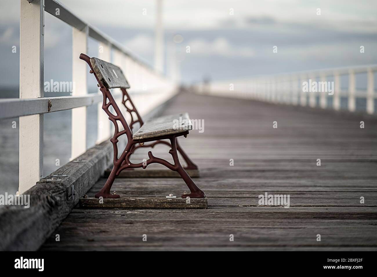 Wooden bench on Urangan Pier, Hervey Bay, Queensland, Australia Stock ...