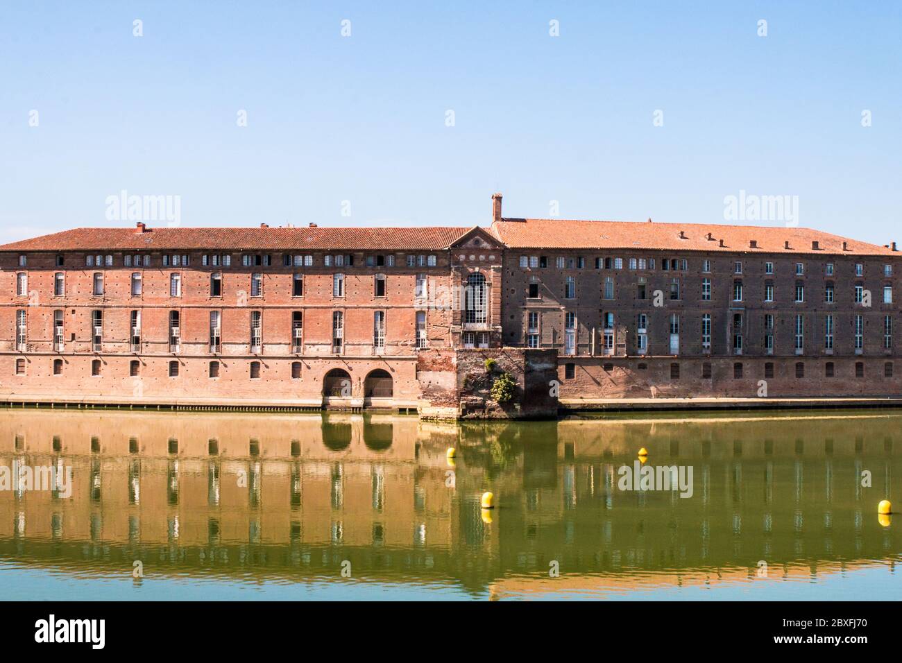 Toulouse landmarks on the bank of river Garone. Hospital de La Grave ...