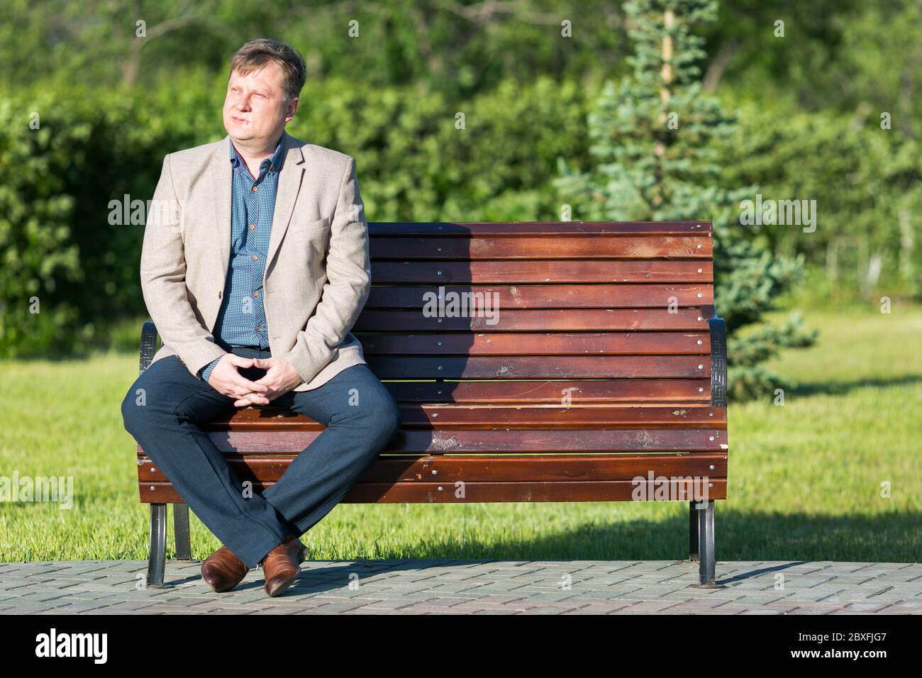 Male model posing on bench hi-res stock photography and images - Alamy