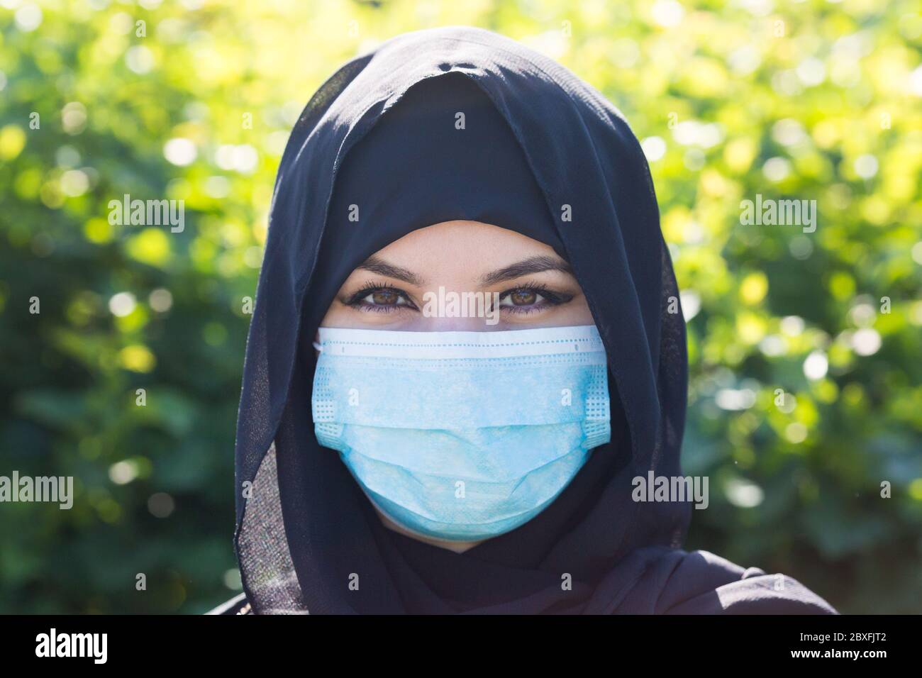 Muslim Woman With Face Mask High Resolution Stock Photography and ...