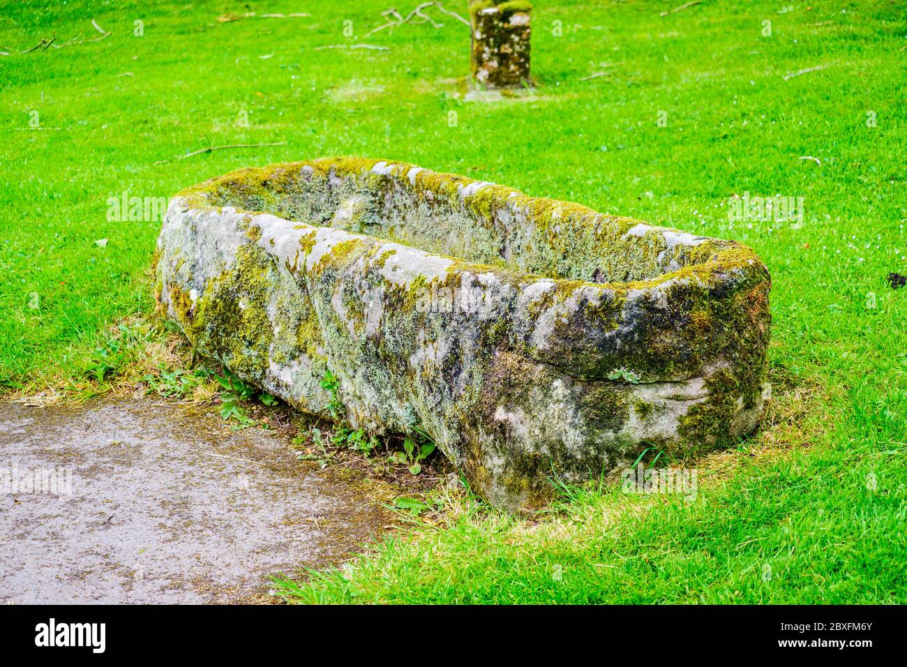 cracked stone coffin or tomb in churchyard UK Stock Photo - Alamy