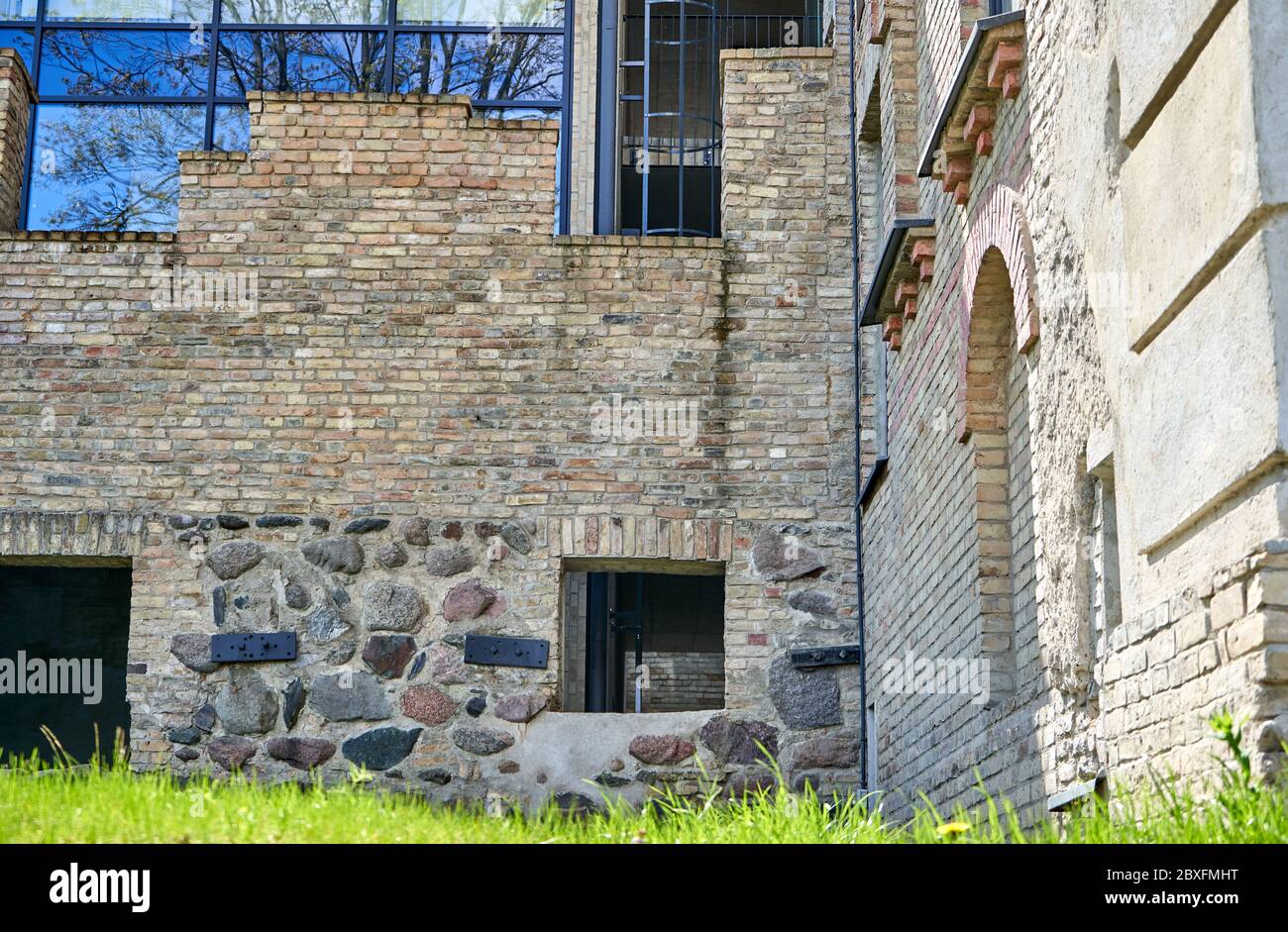 New modern building on the remains of the ancient times factory Stock ...