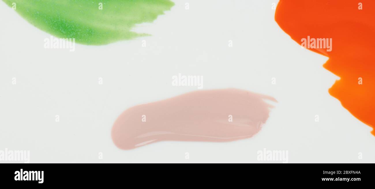 Creamy color paint stroke isolated on white background close up view ...