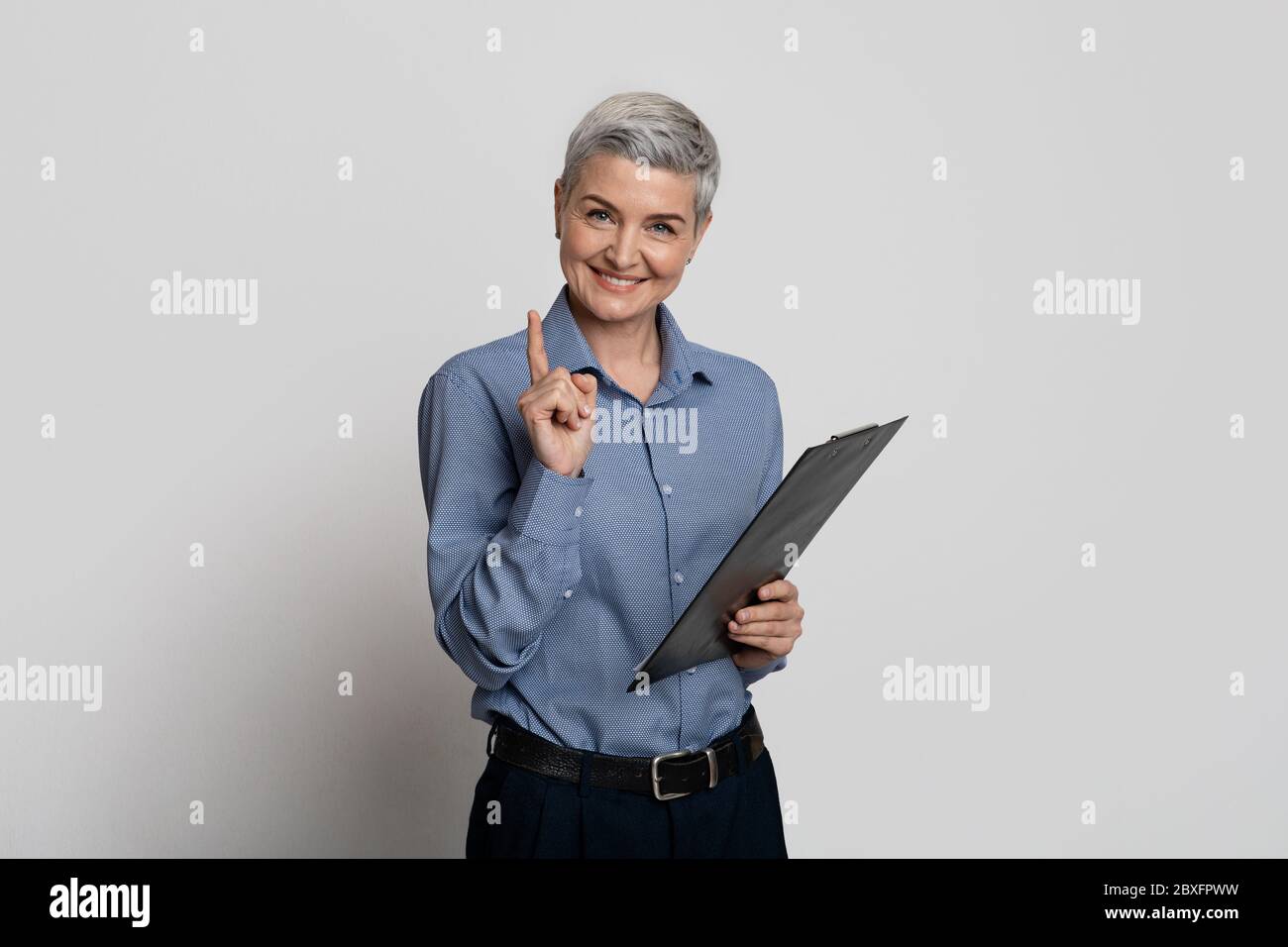 Business woman showing middle finger hi-res stock photography and ...