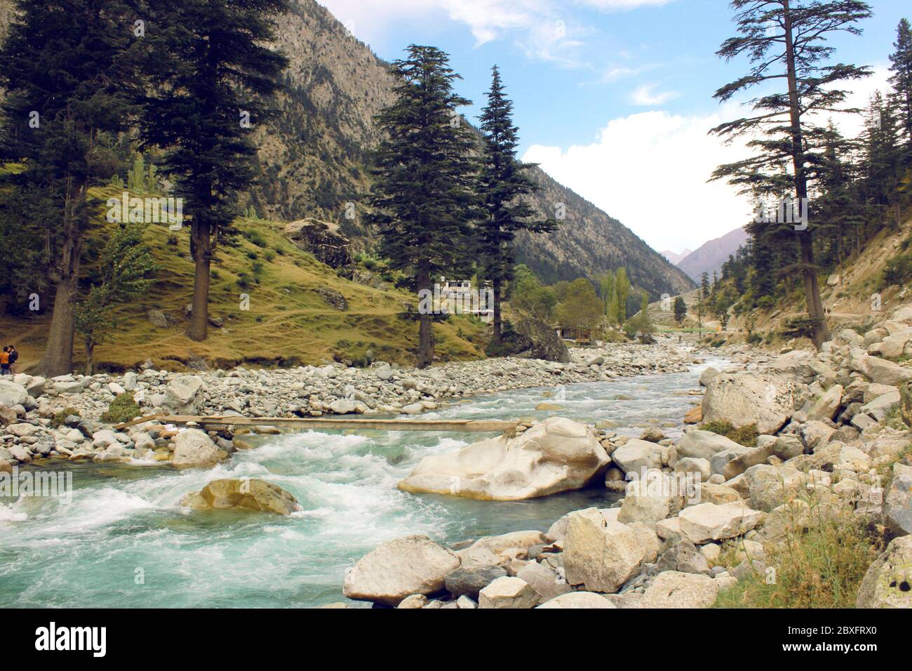 Beautiful river in the mountains with blue skys, pure green water and ...