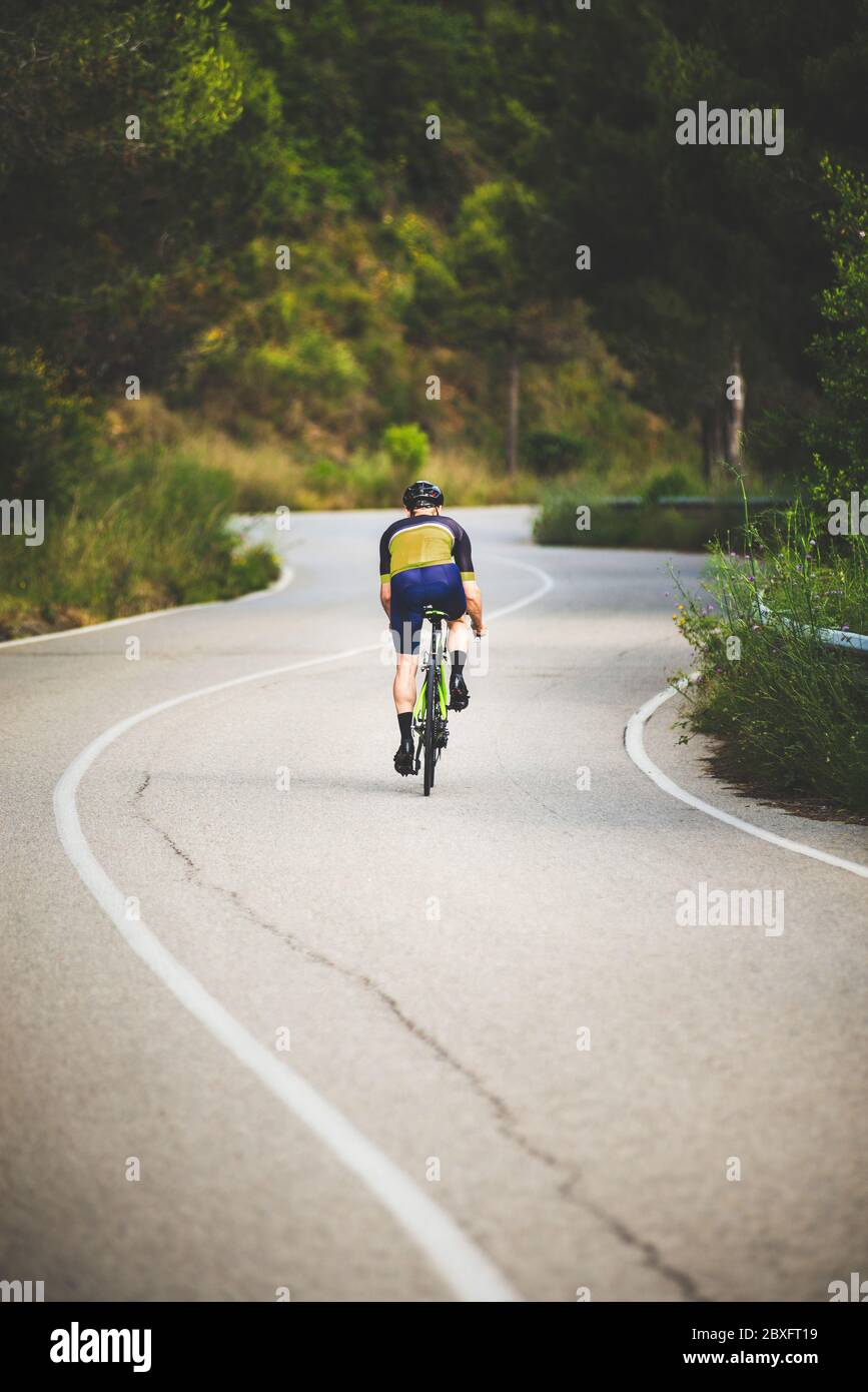 Professional road bike rider in action Stock Photo - Alamy