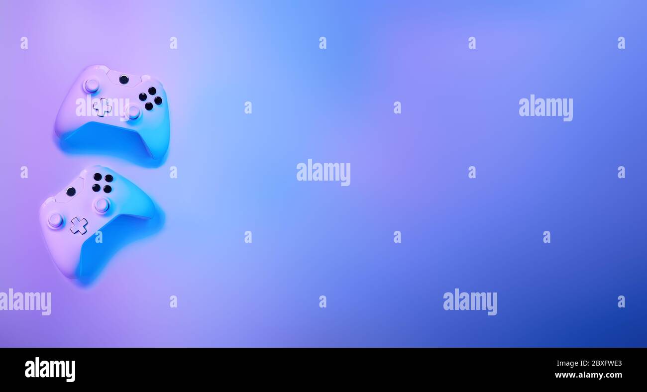 Gamepads in violet snd blue neon colors. Gamer concept Stock Photo - Alamy