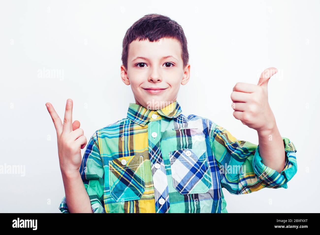 little cute real boy on white background gesture smiling close up ...