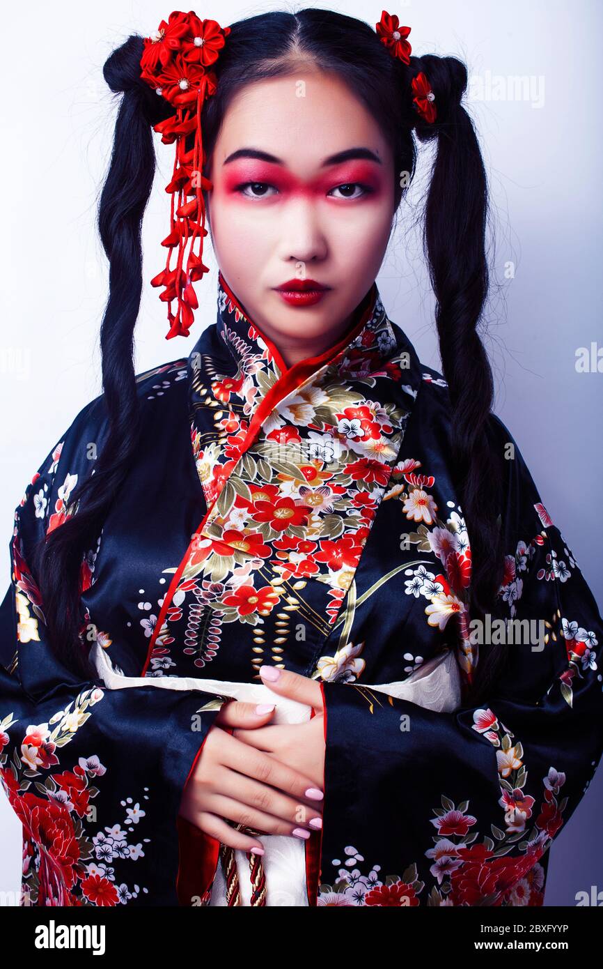 young pretty geisha in black kimono with sakura, asian ethno closeup on ...
