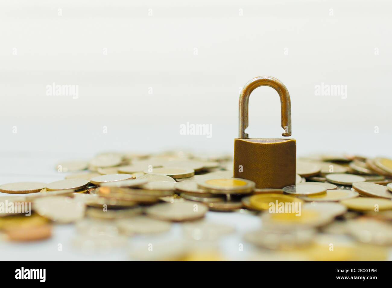 Coin money and lock, on gray background. Saving and financial security ...