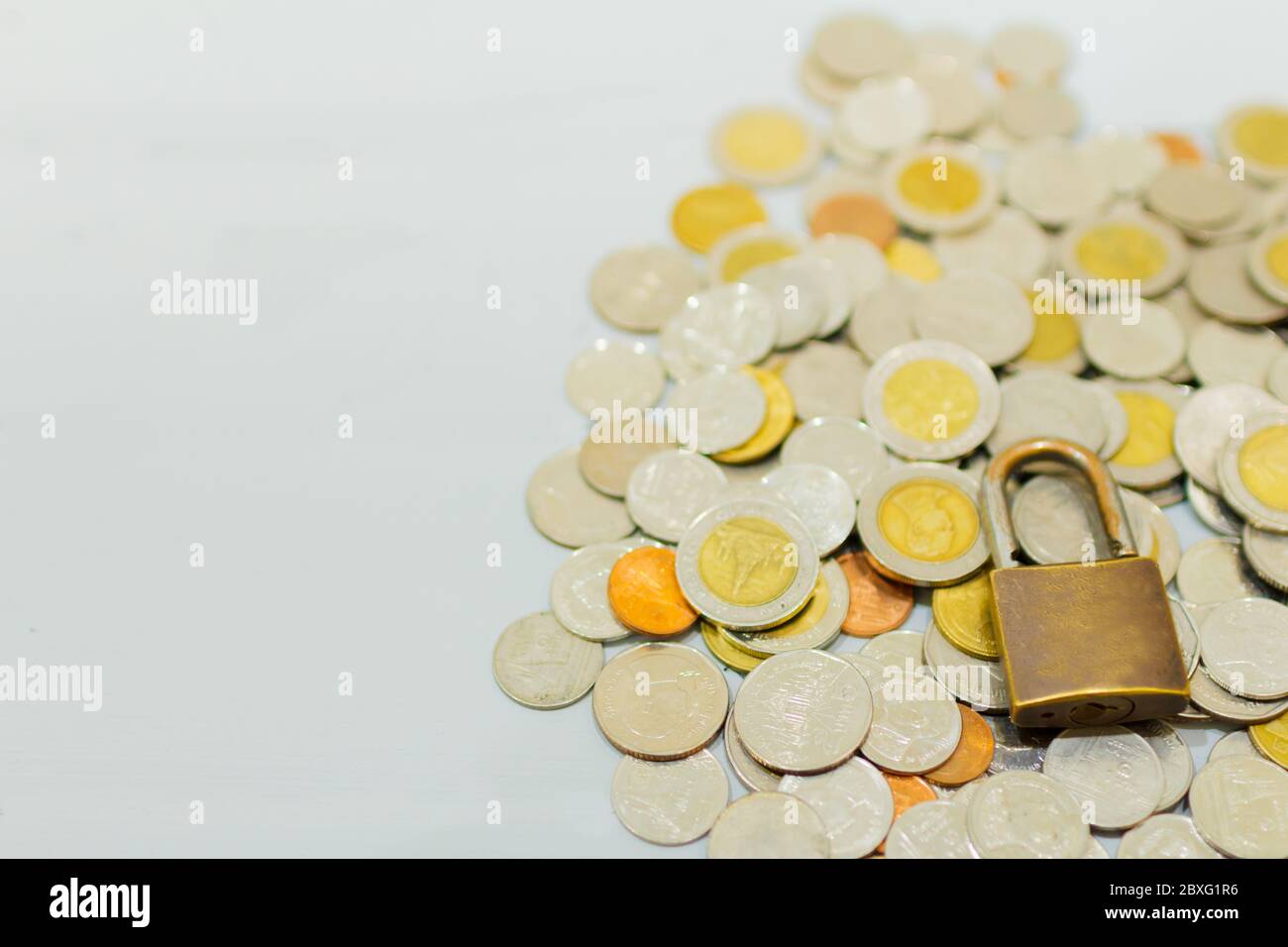 Coin money and lock, on gray background. Saving and financial security ...