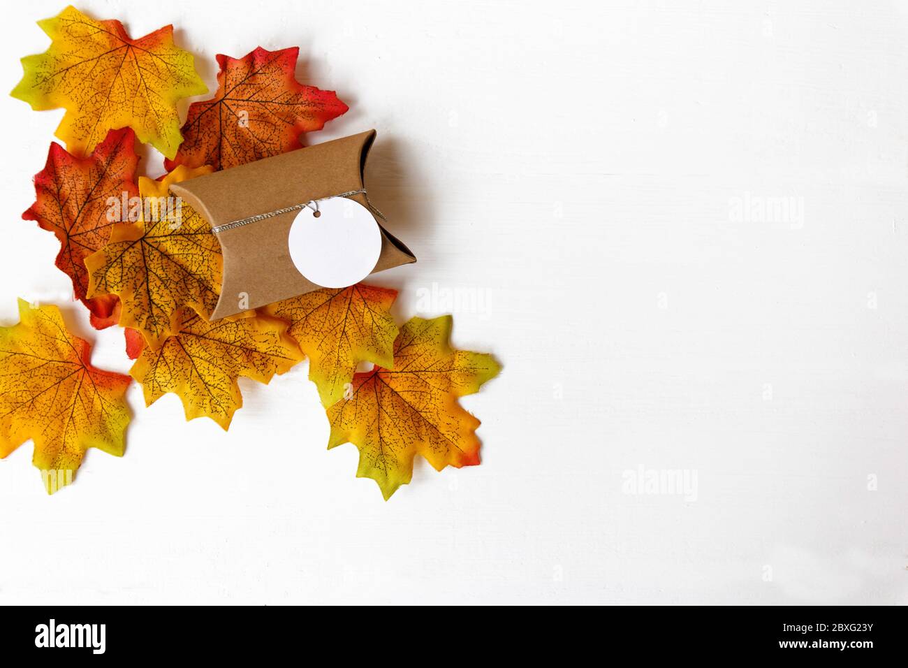 The gift box ,maple leaf and space for text with white background Stock ...