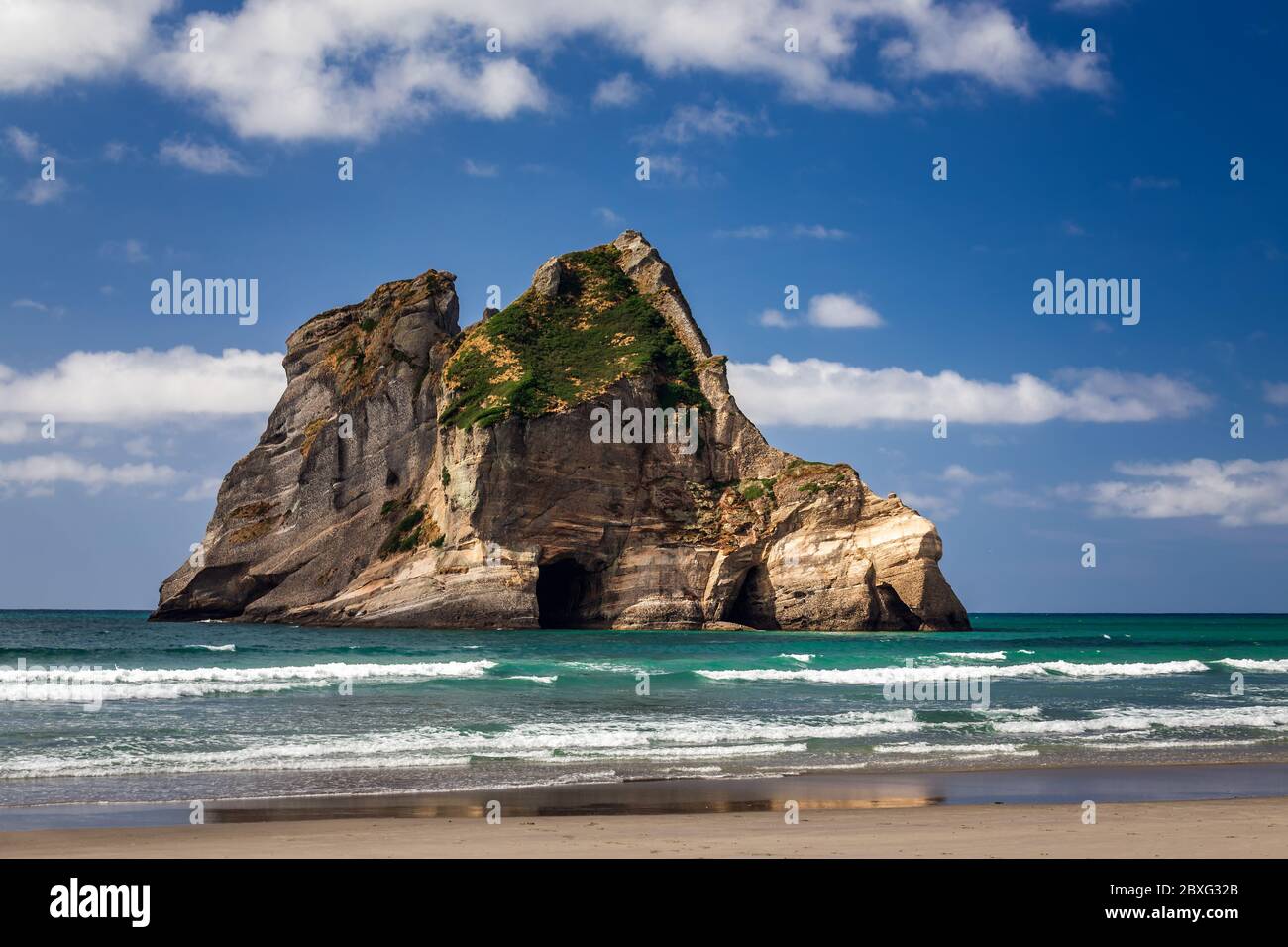 Famous rock formations on the Wharariki beach in National Park. Nelson ...