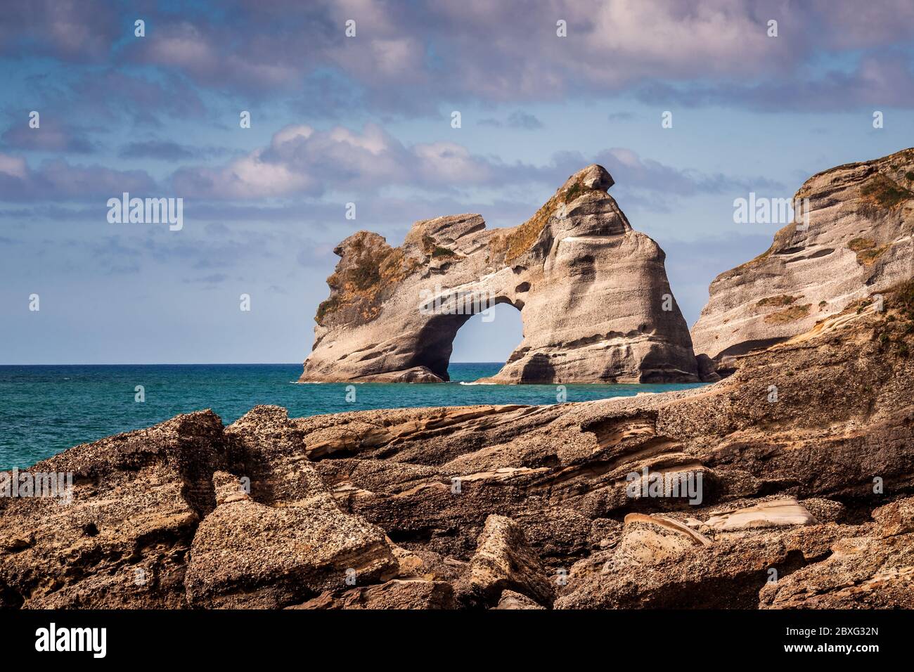 Famous rock formations on the Wharariki beach in National Park. Nelson ...