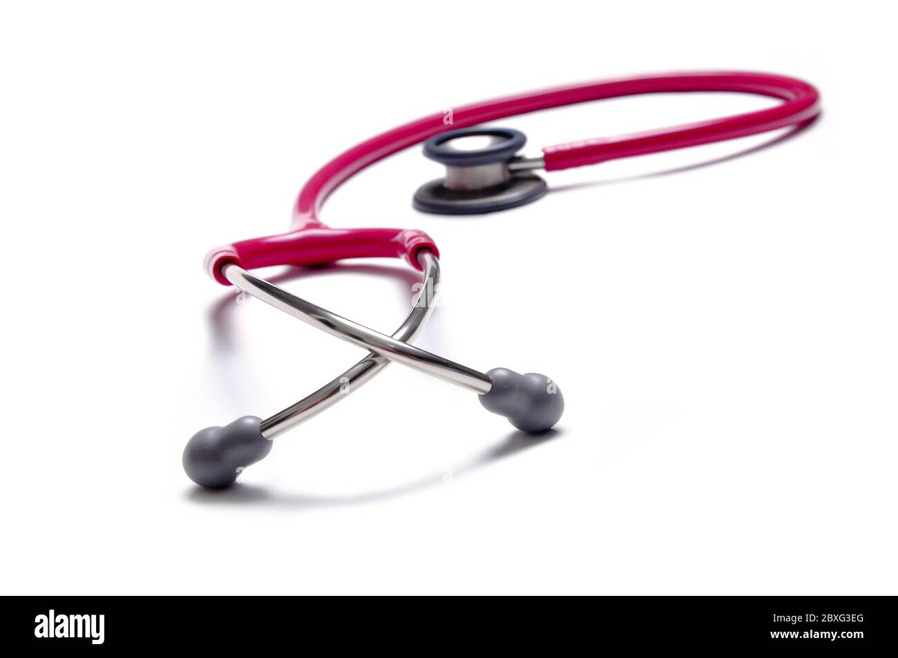 Pink colour stethoscopes isolated on white background Stock Photo - Alamy