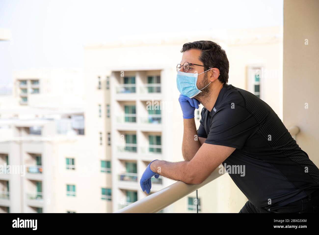 arab man wearing a mask and gloves to protect himself from a virus when ...