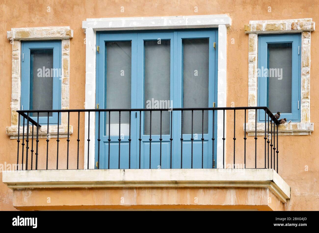 Doors and windows painted blue and decorated with white frame Stock ...