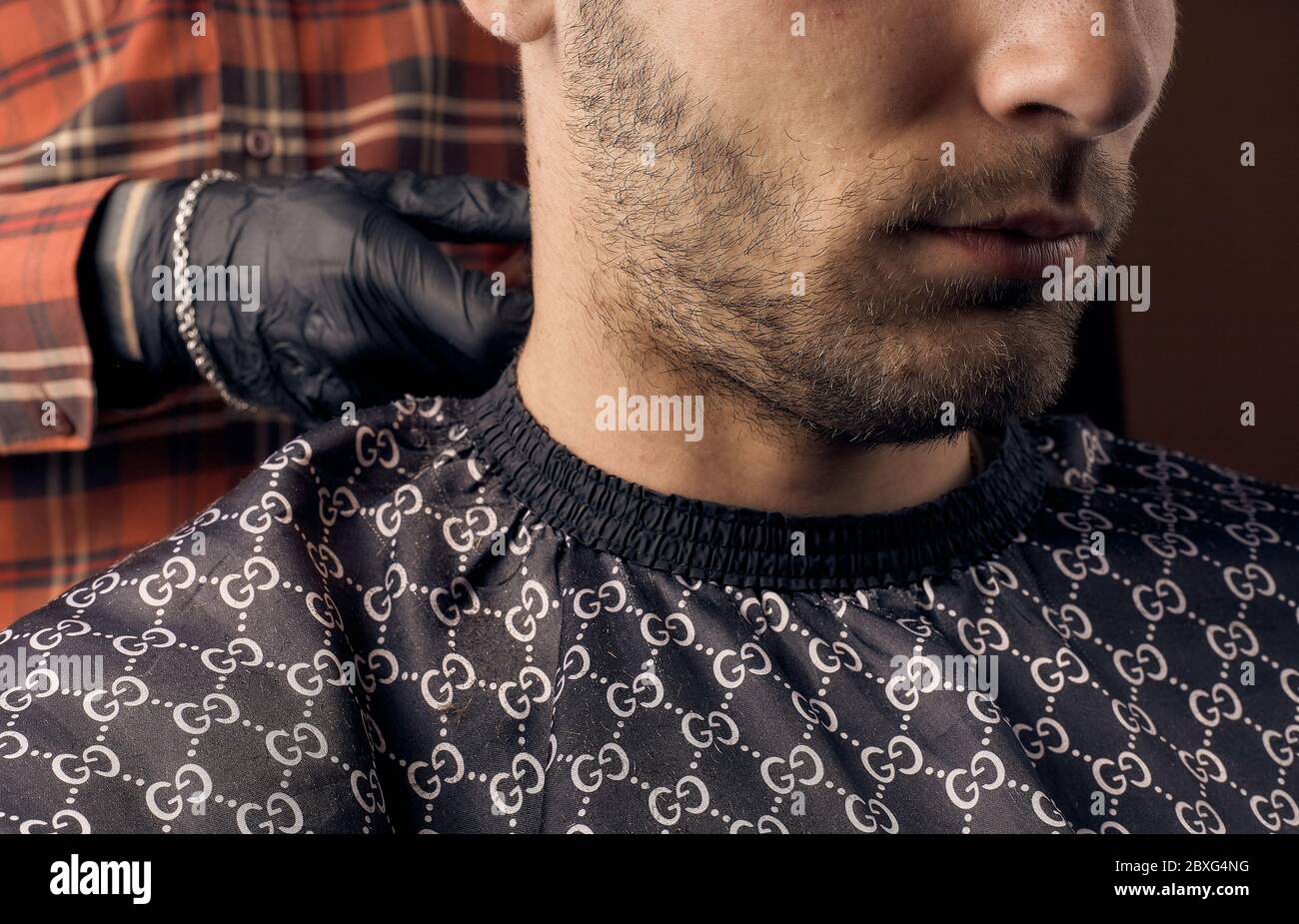 Hairdresser barber cuts client close hi-res stock photography and ...