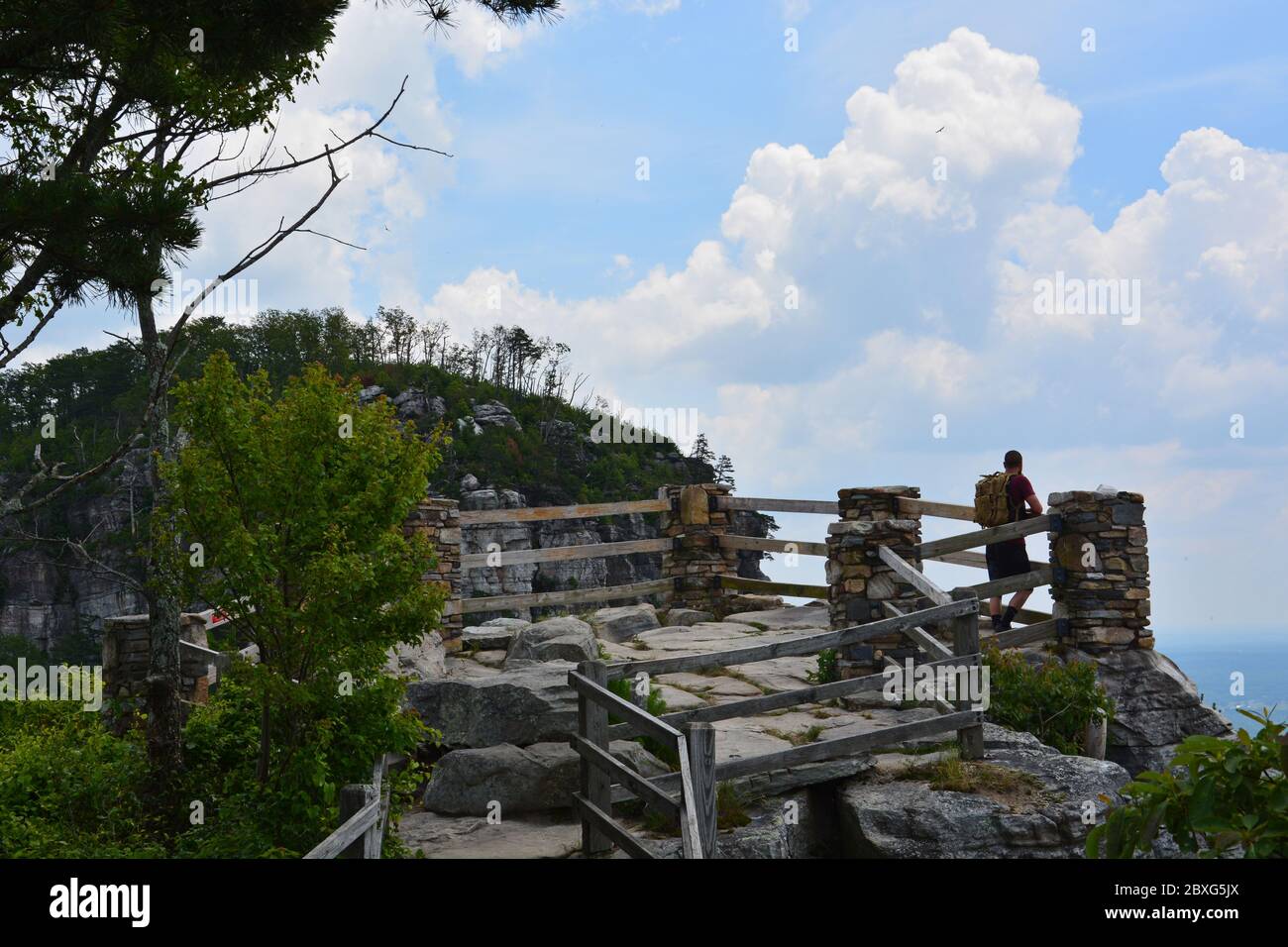 A visitor stops at the Little Pinnacle Overlook at Pilot Mountain State ...