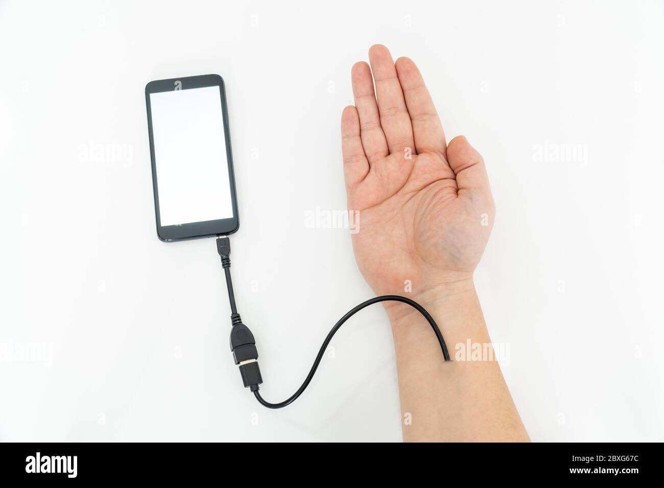 Augmented human hand connected to a smartphone via usb cable and ...