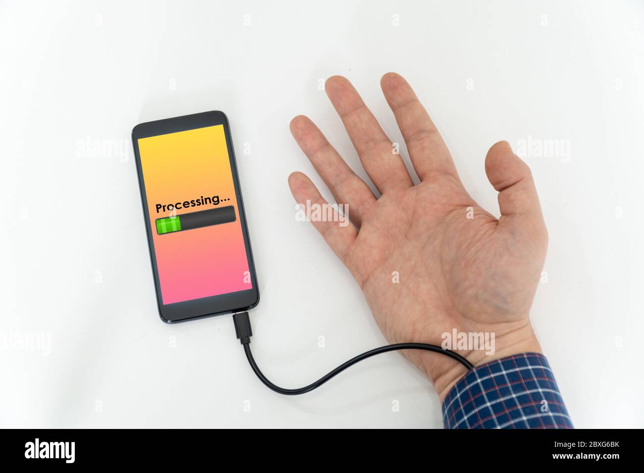 Augmented human hand connected to a smartphone via usb cable and ...
