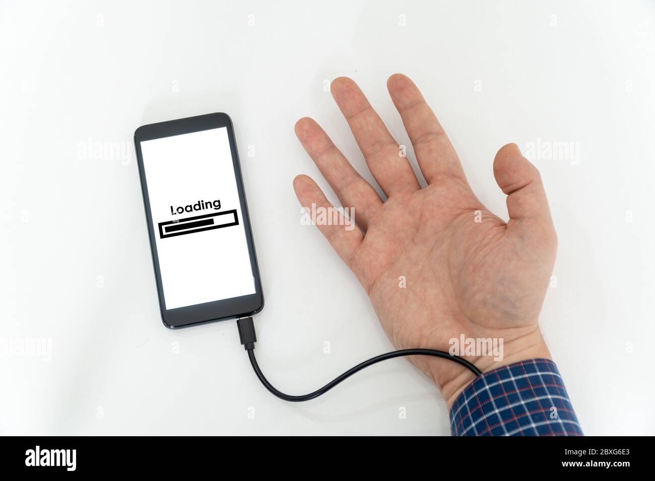 Augmented human hand connected to a smartphone via usb cable and ...