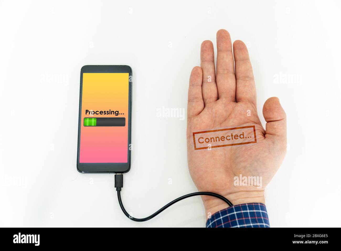 Augmented human hand connected to a smartphone via usb cable and ...