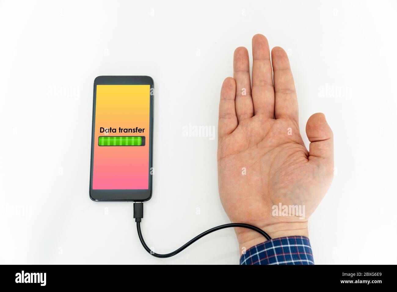 Augmented human hand connected to a smartphone via usb cable and ...
