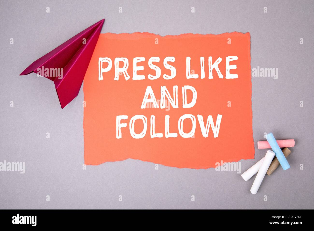 PRESS LIKE AND FOLLOW concept. Text on note sheet, paper plane, symbol ...